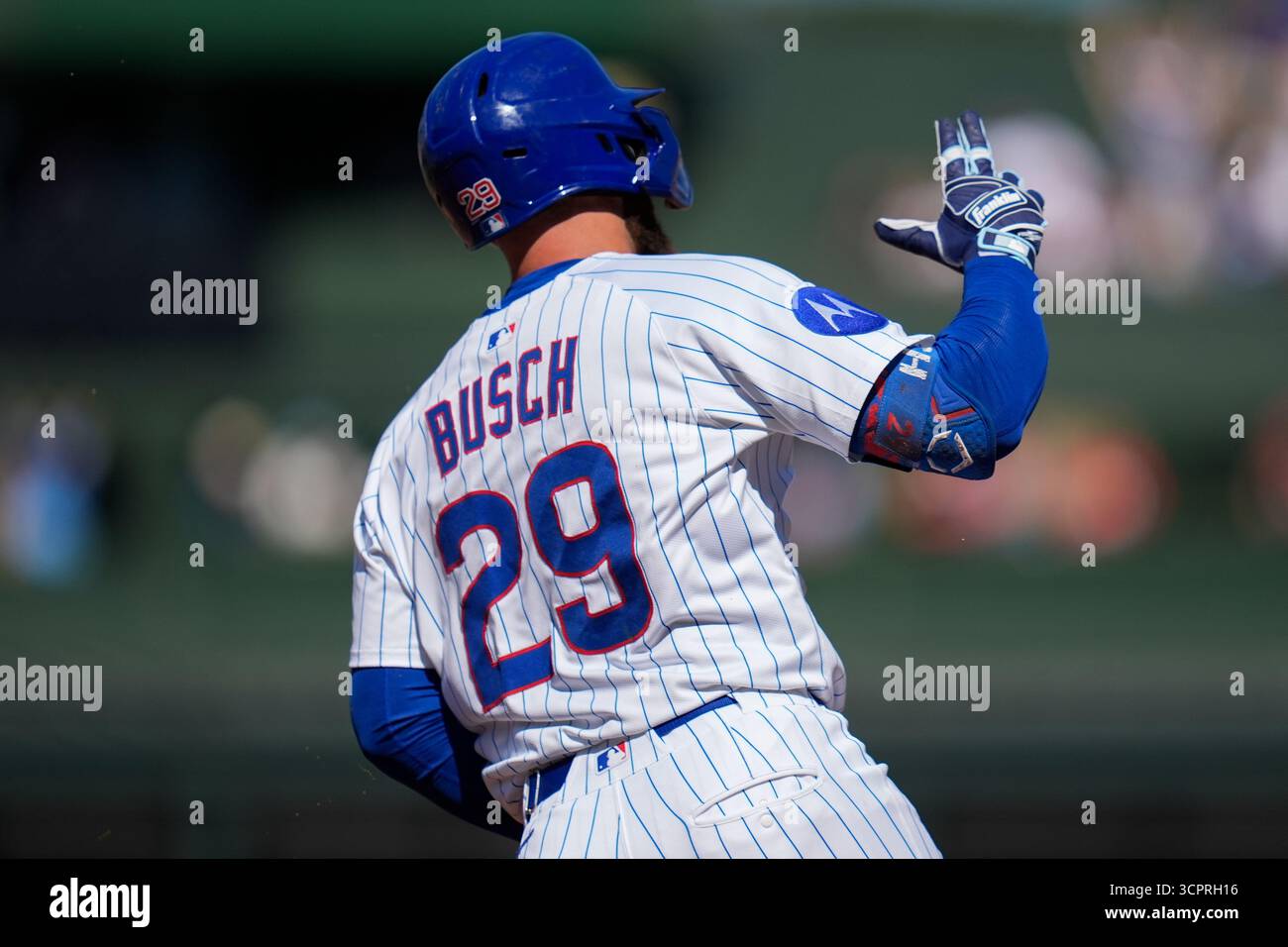 Chicago Cubs' Michael Busch (29) runs the bases after hitting a home ...