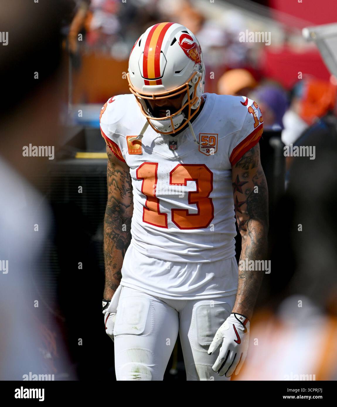 Tampa Bay Buccaneers wide receiver Mike Evans (13) walks towards the ...