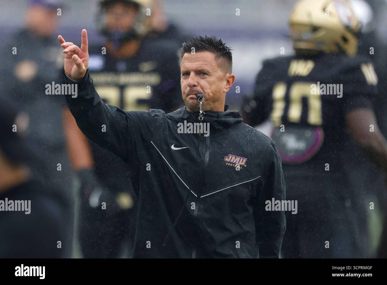 James Madison head coach Bob Chesney runs drills before an NCAA ...