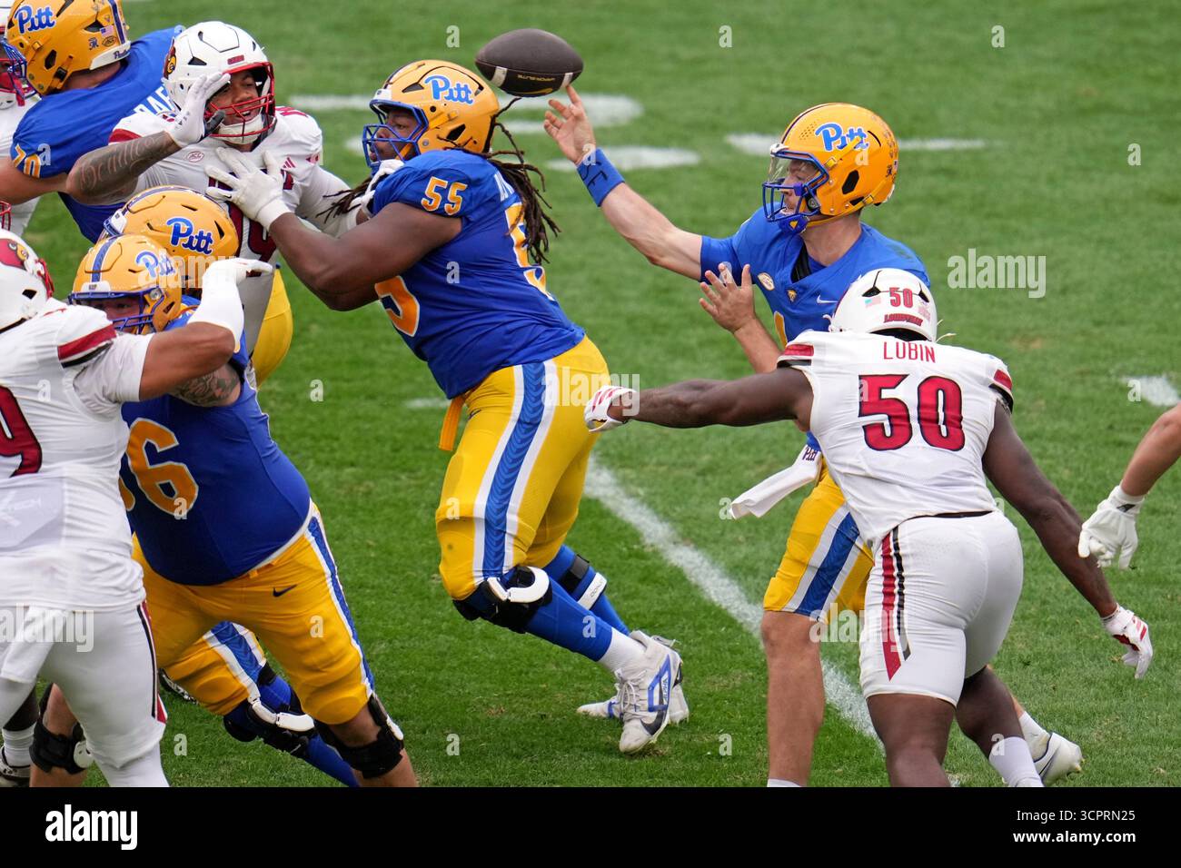 Pittsburgh quarterback Eli Holstein, top right, throws a pass under ...