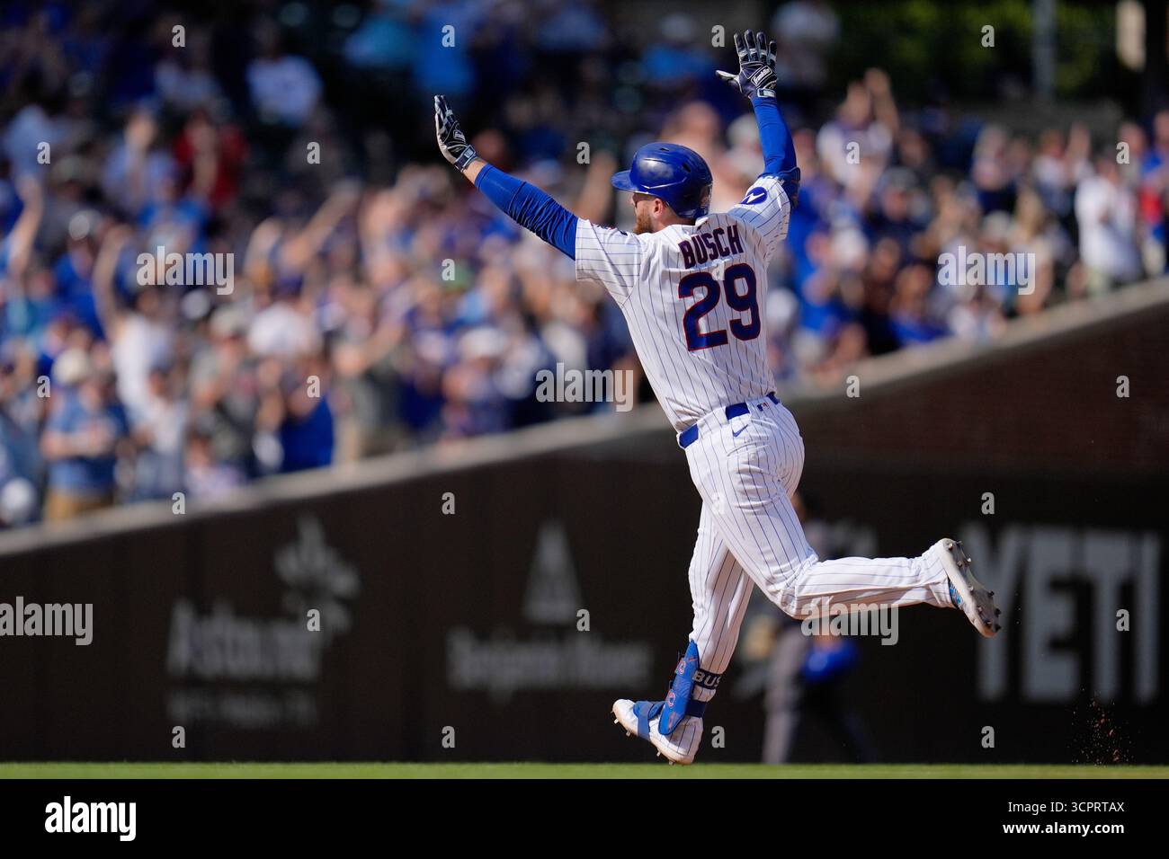 Chicago Cubs' Michael Busch (29) runs the bases after hitting a two-run ...