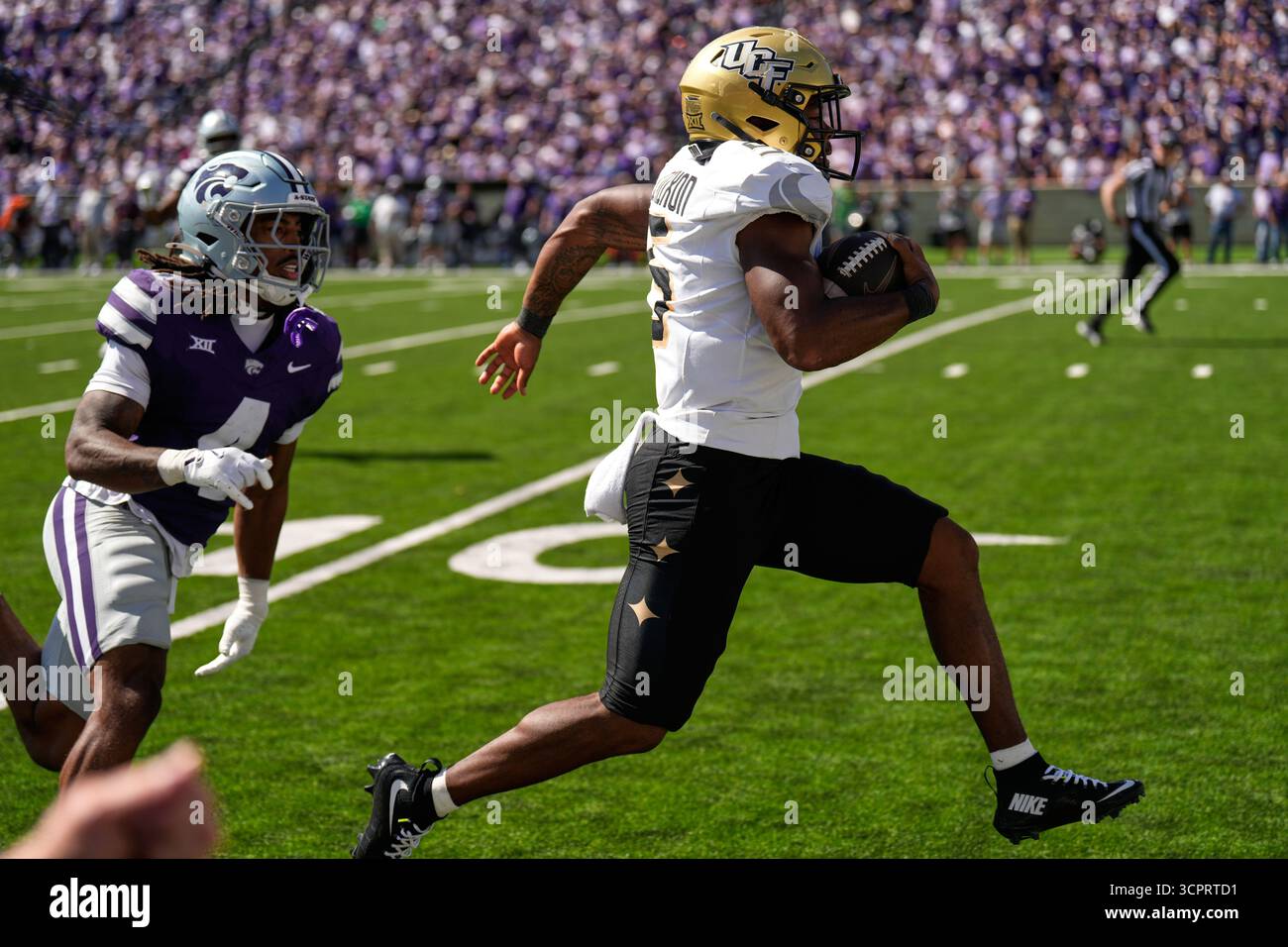 Central Florida running back Jaden Nixon (5) runs past Kansas State ...