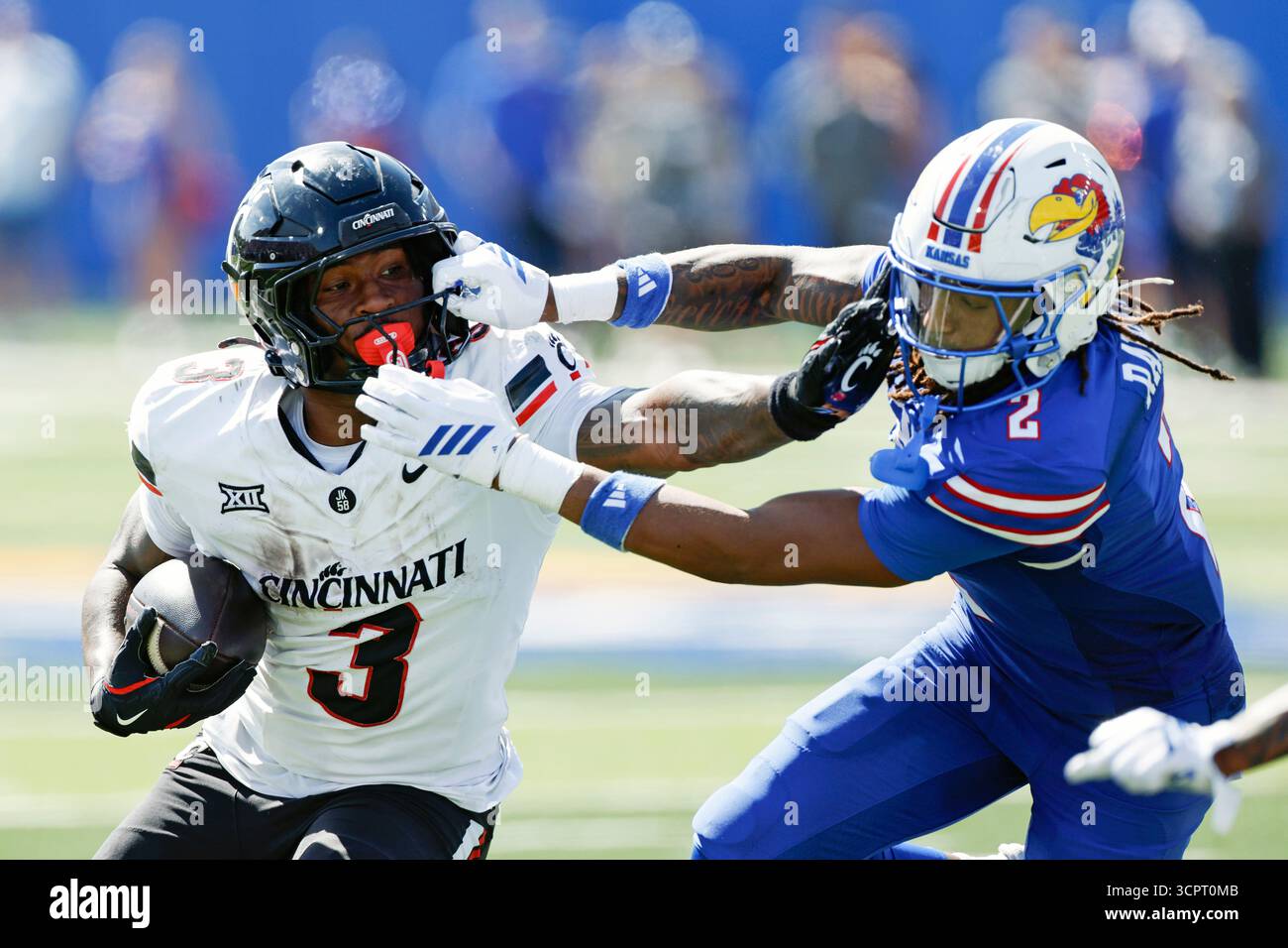 Cincinnati running back Tawee Walker (3) is grabbed by the facemask by ...