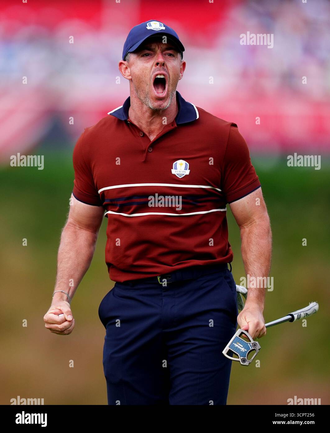 Rory McIlroy of Team Europe reacts to a putt on the 14th during the ...