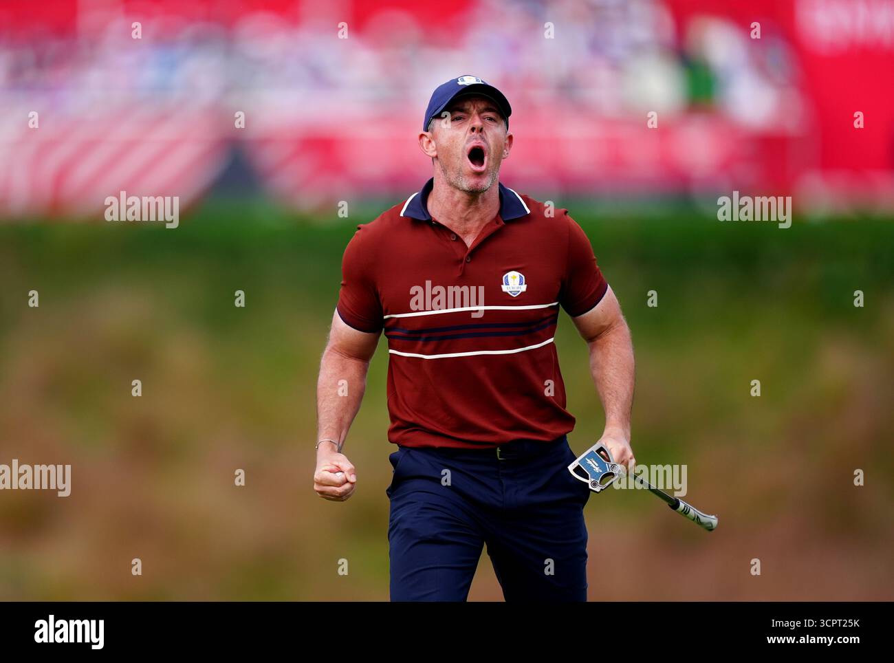Rory McIlroy of Team Europe reacts to a putt on the 14th during the ...