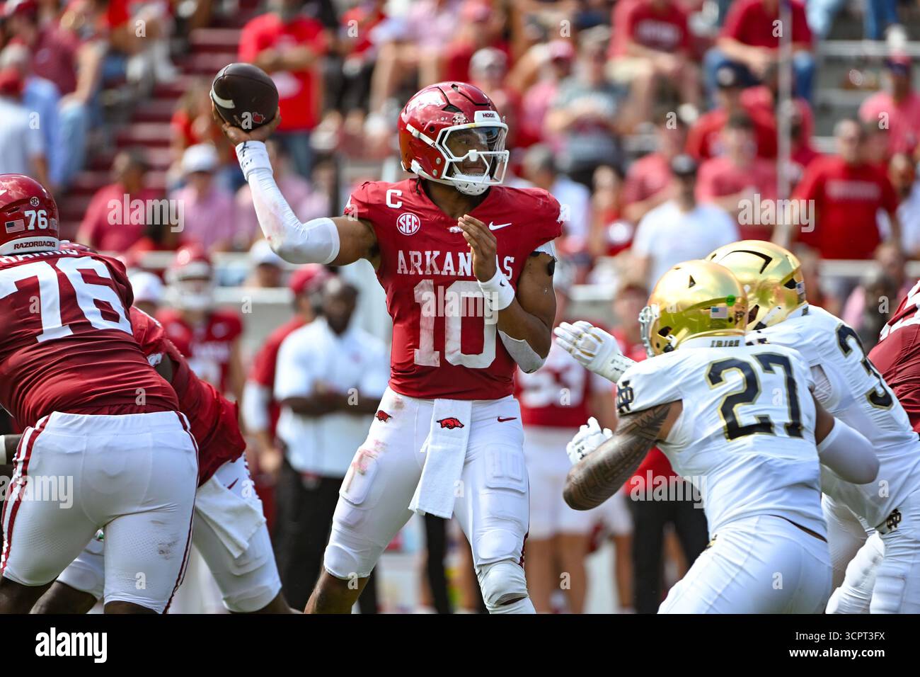 Arkansas quarterback Taylen Green (10) throws a pass under pressure ...