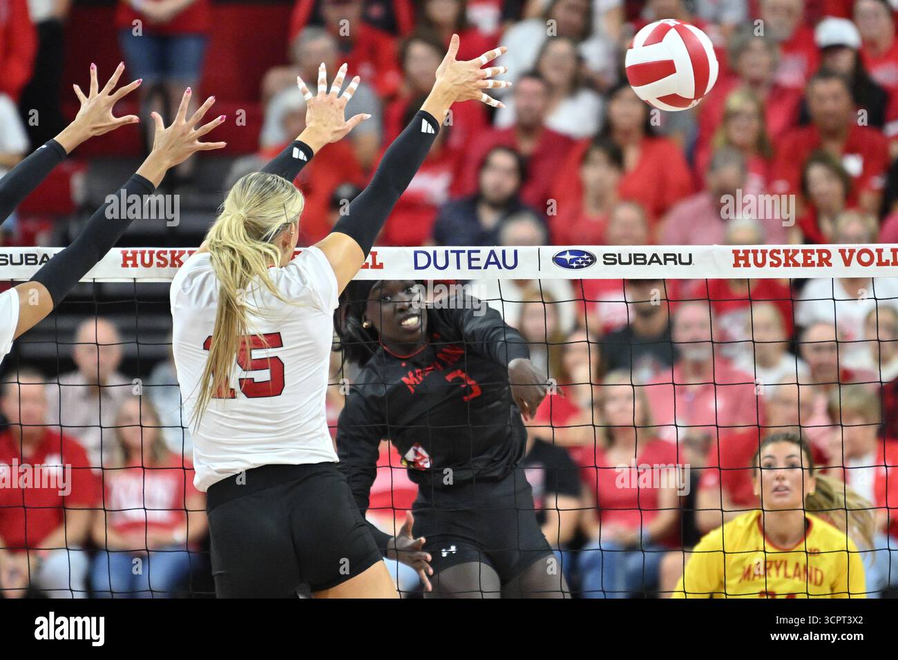 Maryland's Ajack Malual (3) spikes the ball during an NCAA college ...