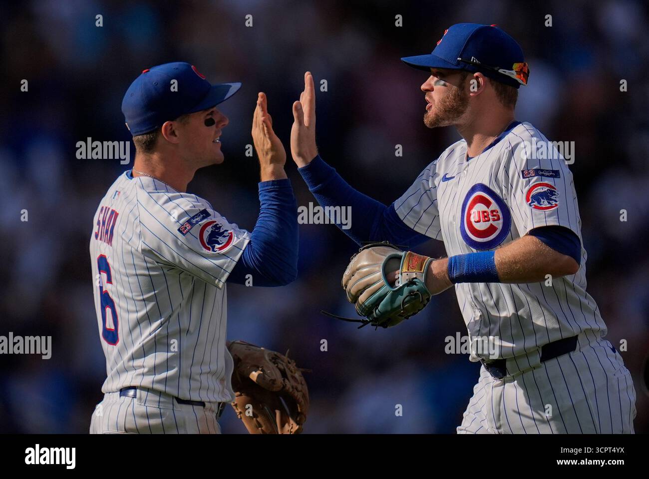 Chicago Cubs left fielder Ian Happ, right, and third baseman Matt Shaw ...