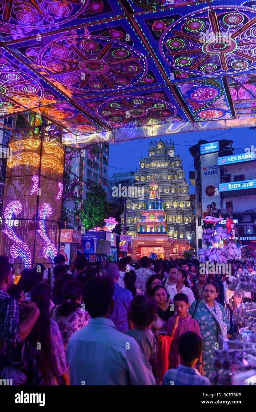 KOLKATA, INDIA - SEPTEMBER 27: Crowds thronged at Durga Puja Pandal at Ekdalia Evergreen Club on ...