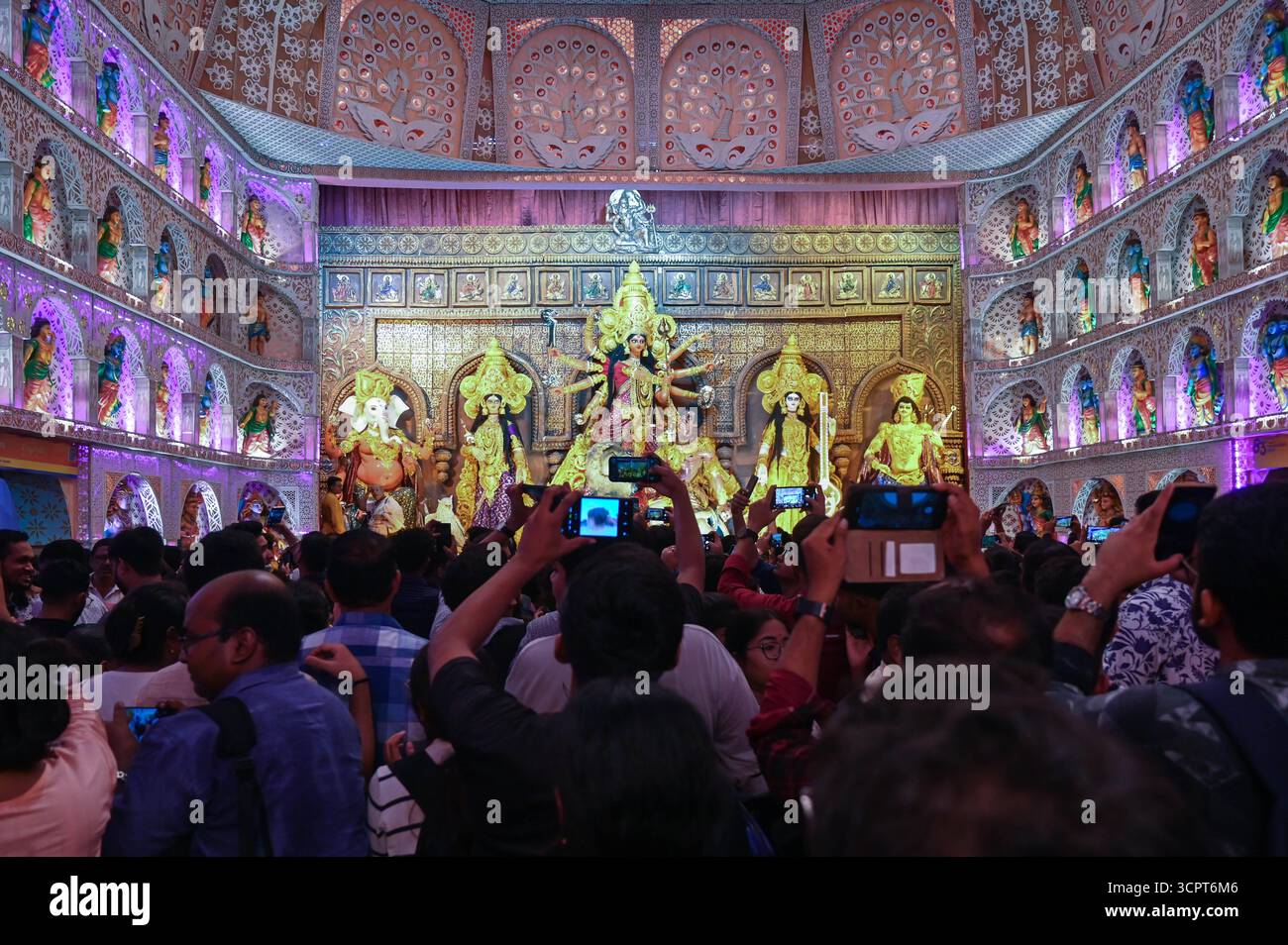 KOLKATA, INDIA - SEPTEMBER 27: Crowds thronged at Durga Puja Pandal at Ekdalia Evergreen Club on ...