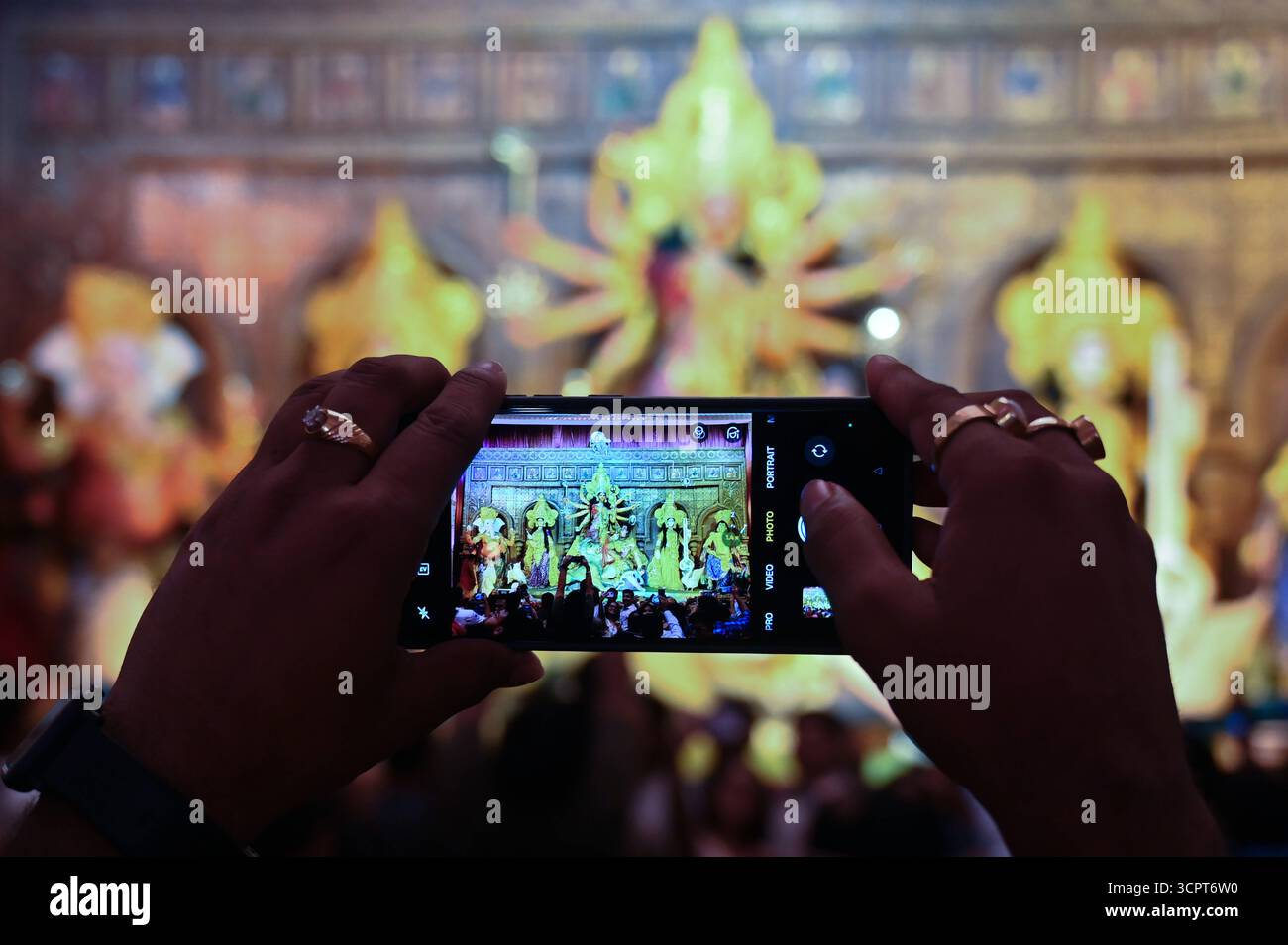 KOLKATA, INDIA - SEPTEMBER 27: Crowds thronged at Durga Puja Pandal at Ekdalia Evergreen Club on ...