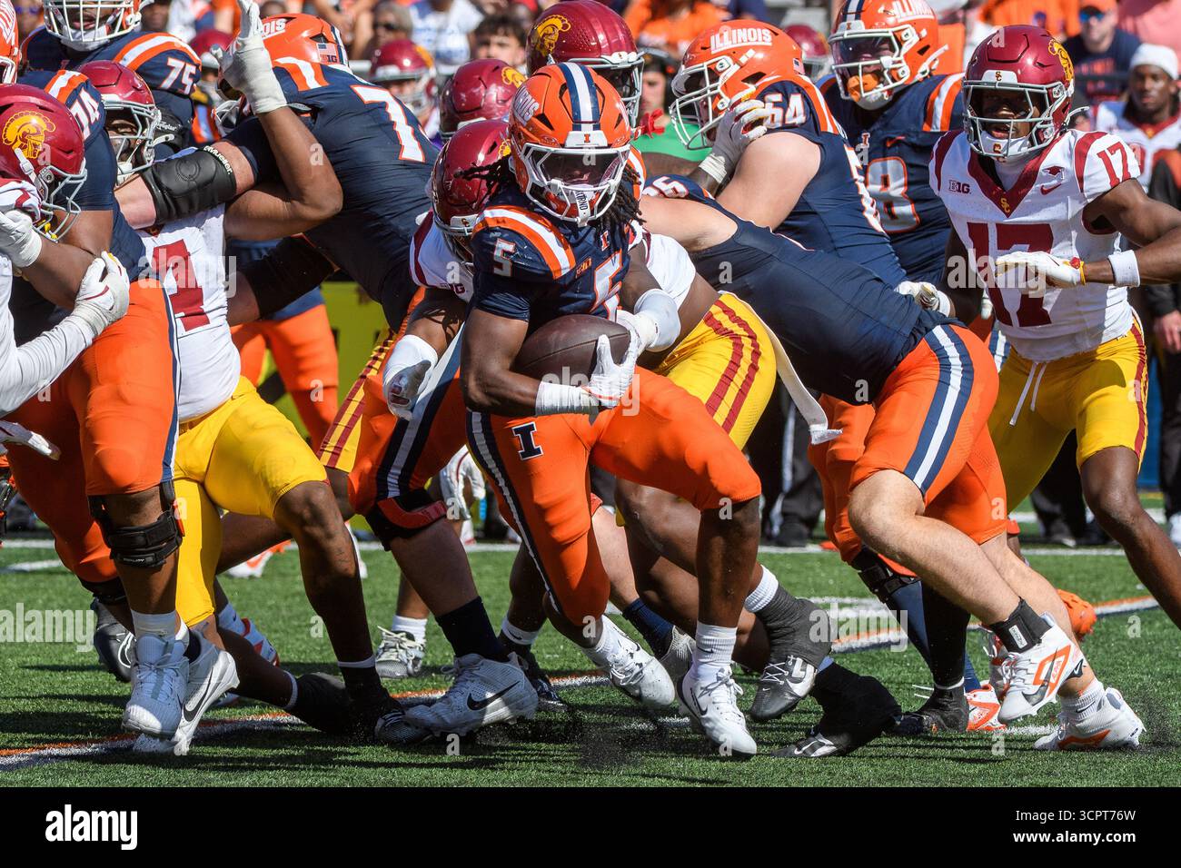 Illinois running back Ca'Lil Valentine (5) eludes defenders during the ...