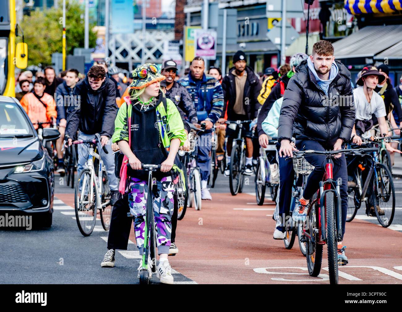 Dublin, Ireland - September 27th 2025 - Cyclists and rider on scooter ...
