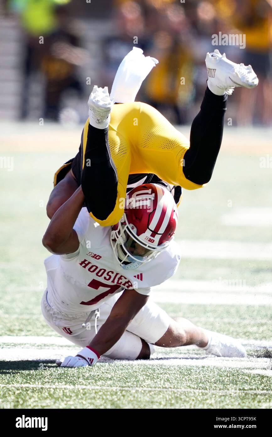 Indiana defensive back Louis Moore (7) tackles Iowa running back Kamari ...