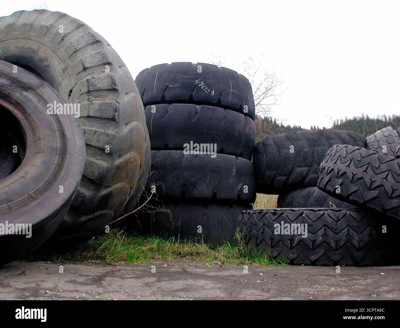old round car tires in garbage, waste separation and recycling old ...
