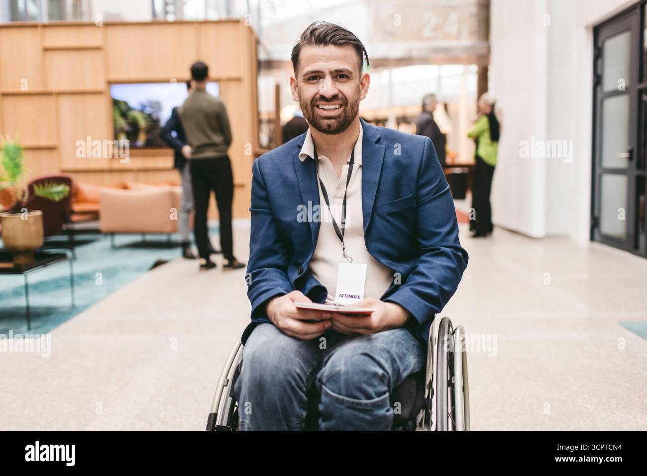 Portrait of smiling male business expert with physical disability ...