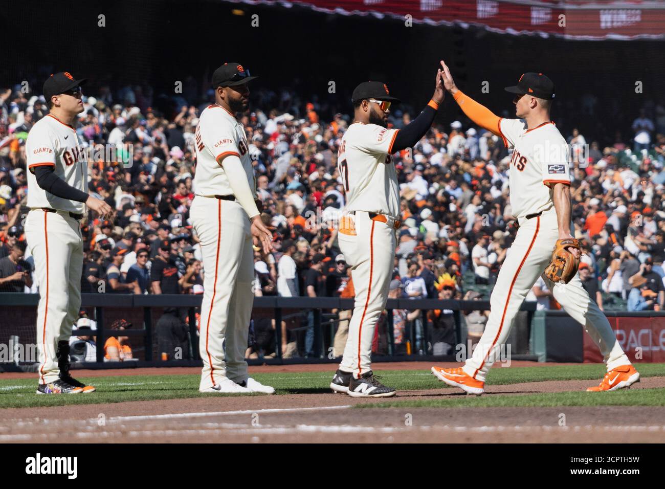 San Francisco Giants outfielder Heliot Ramos high-fives third baseman ...
