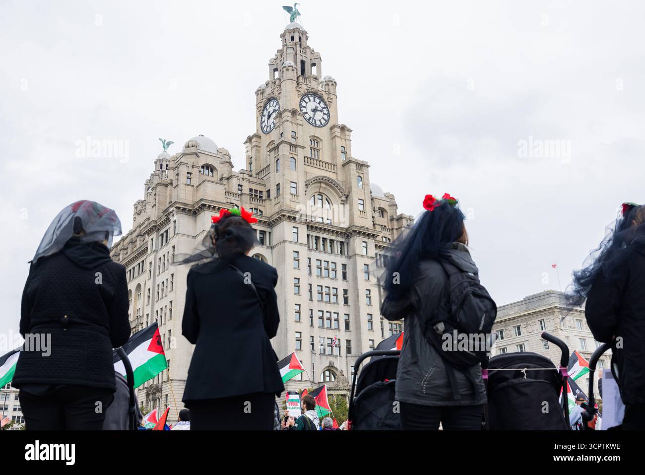 Liverpool, UK. 27 SEP, 2025. Activists stand in front of the Liver ...