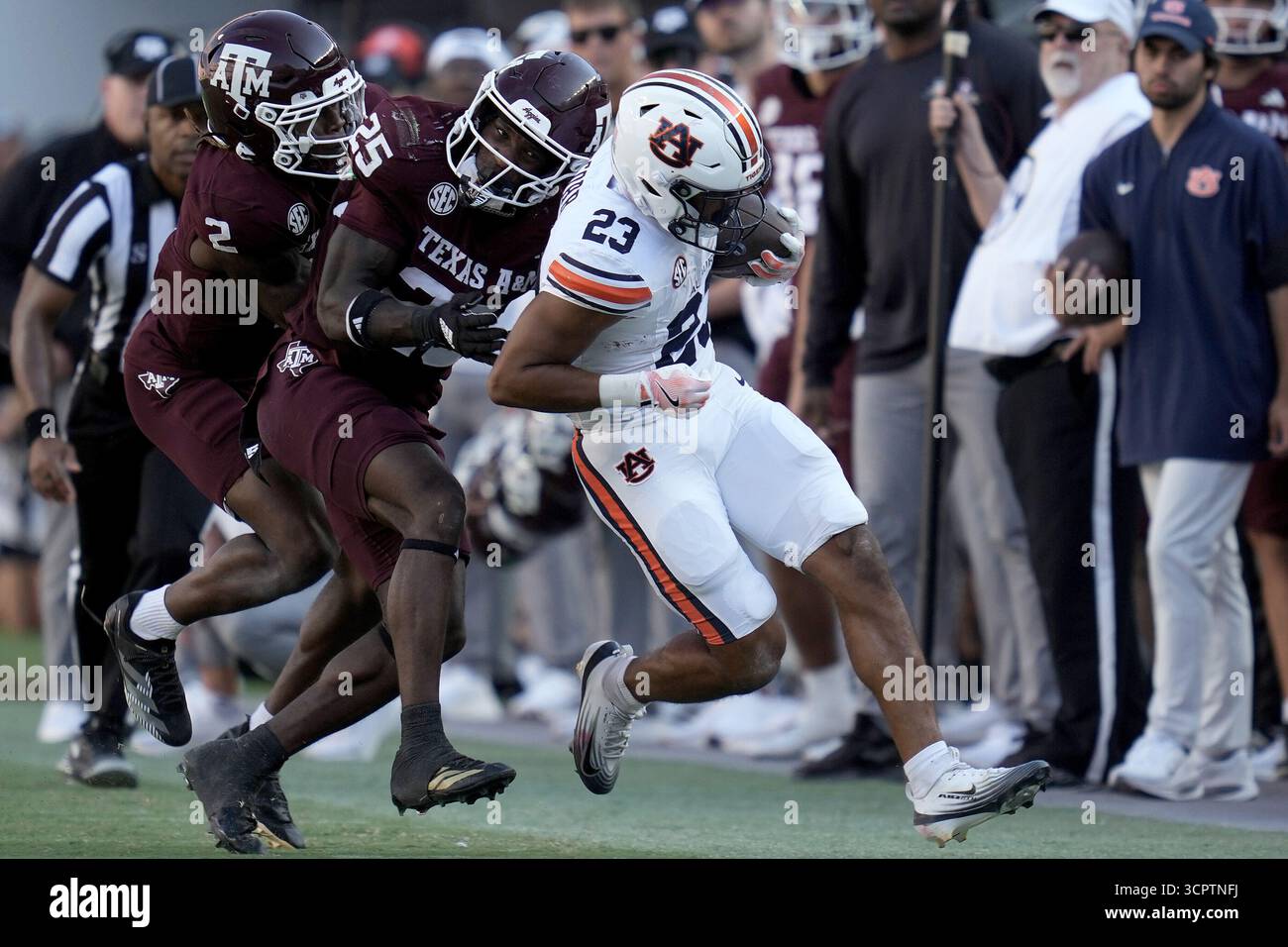Texas A&M safety Dalton Brooks (25) knocks Auburn running back Jeremiah ...