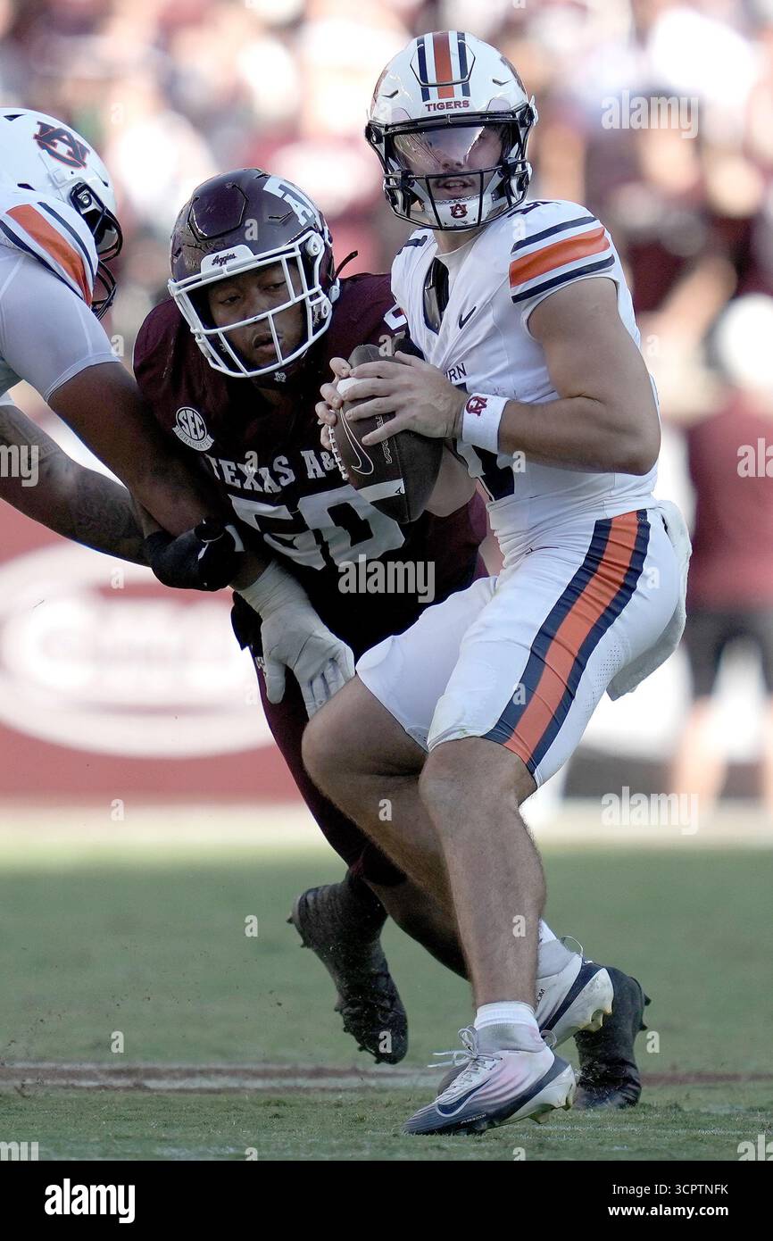 Auburn quarterback Jackson Arnold (11) is pressured by Texas A&M ...