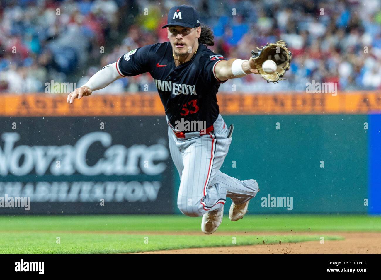 Minnesota Twins second baseman Ryan Fitzgerald leaps for a single from ...