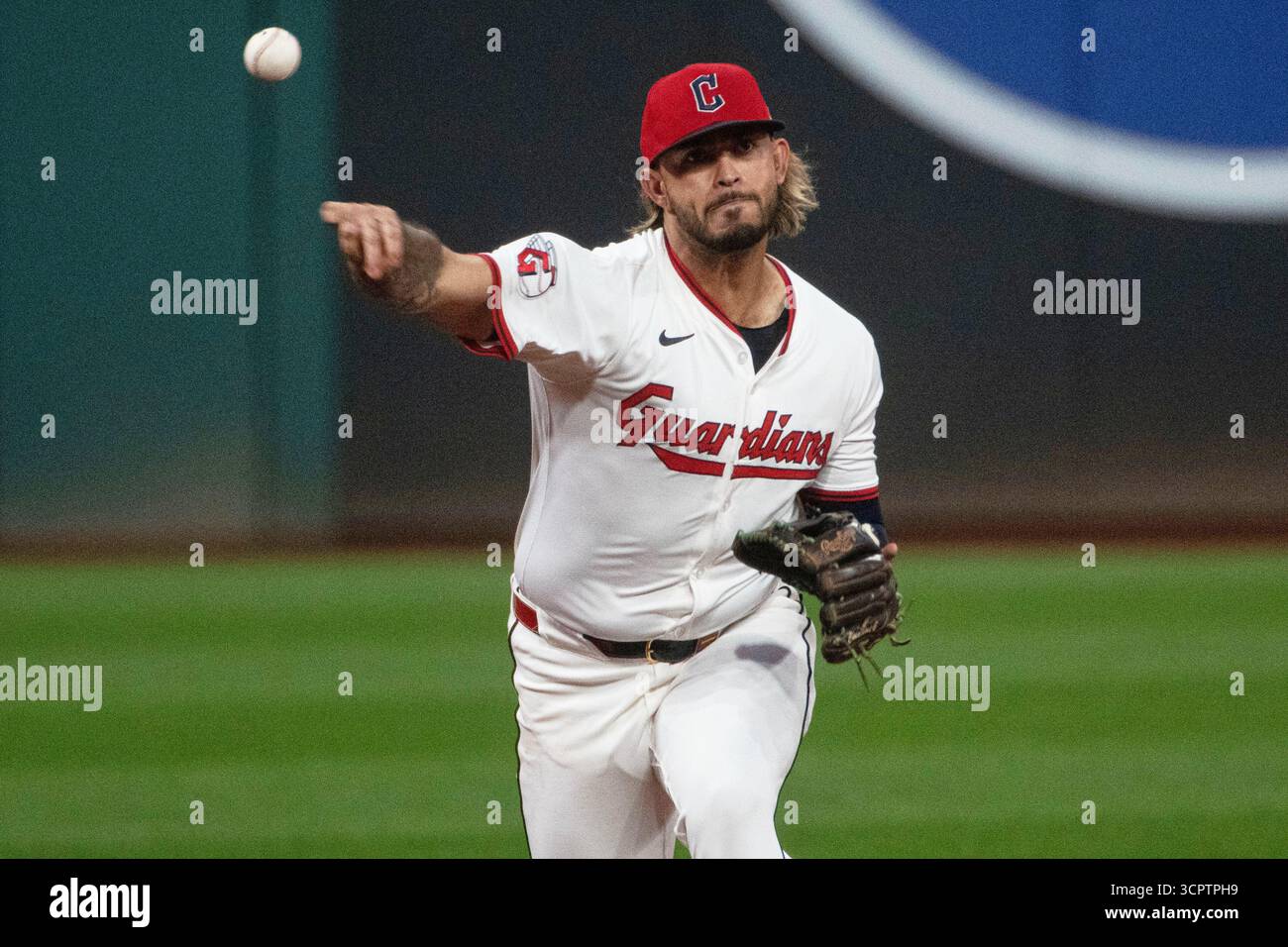 Cleveland Guardians' Gabriel Arias throws out Texas Rangers' Cody Freeman at first base during ...