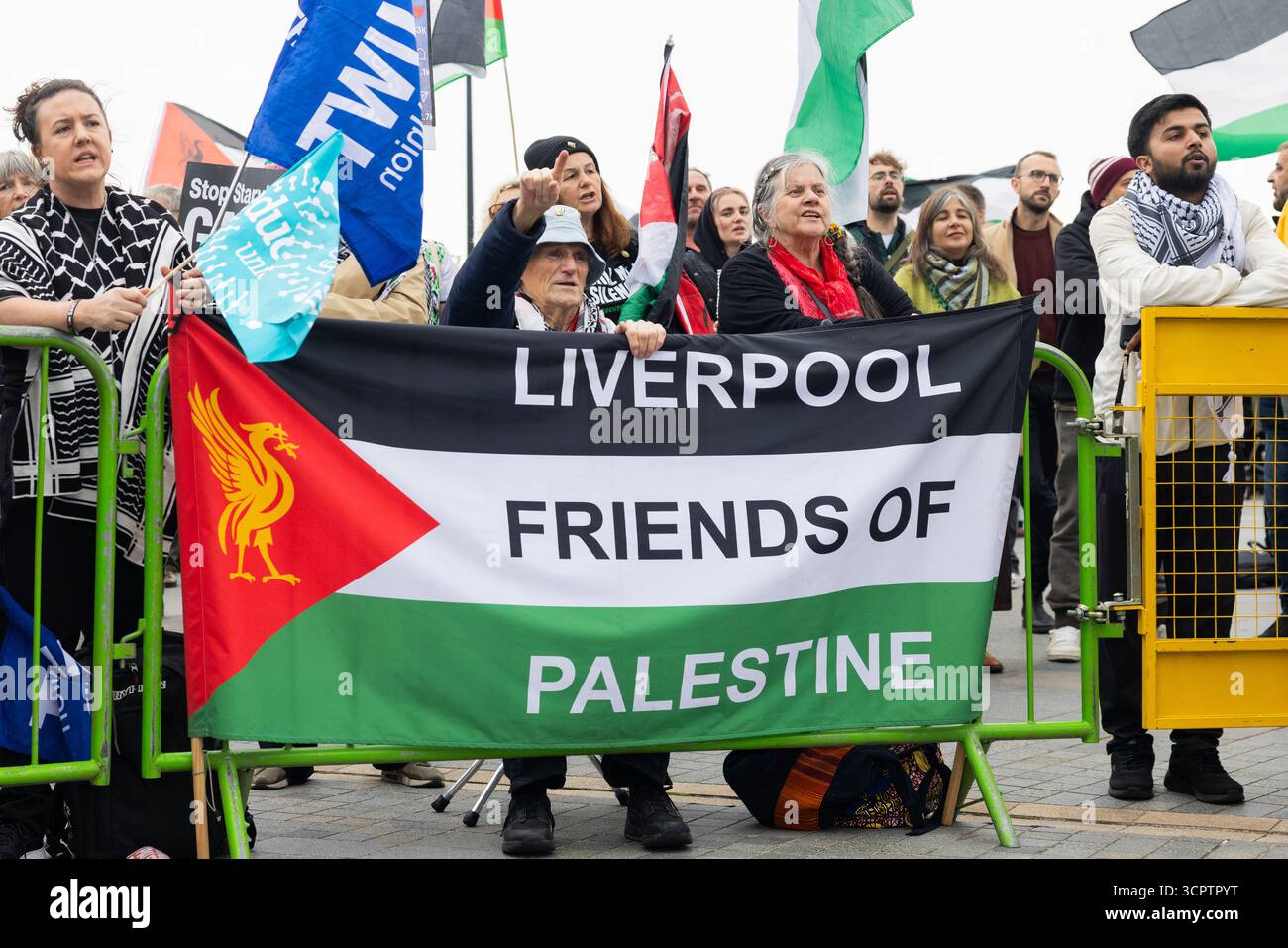 Liverpool, UK. 27 SEP, 2025. Man sits behind "Liverpool Friends of ...