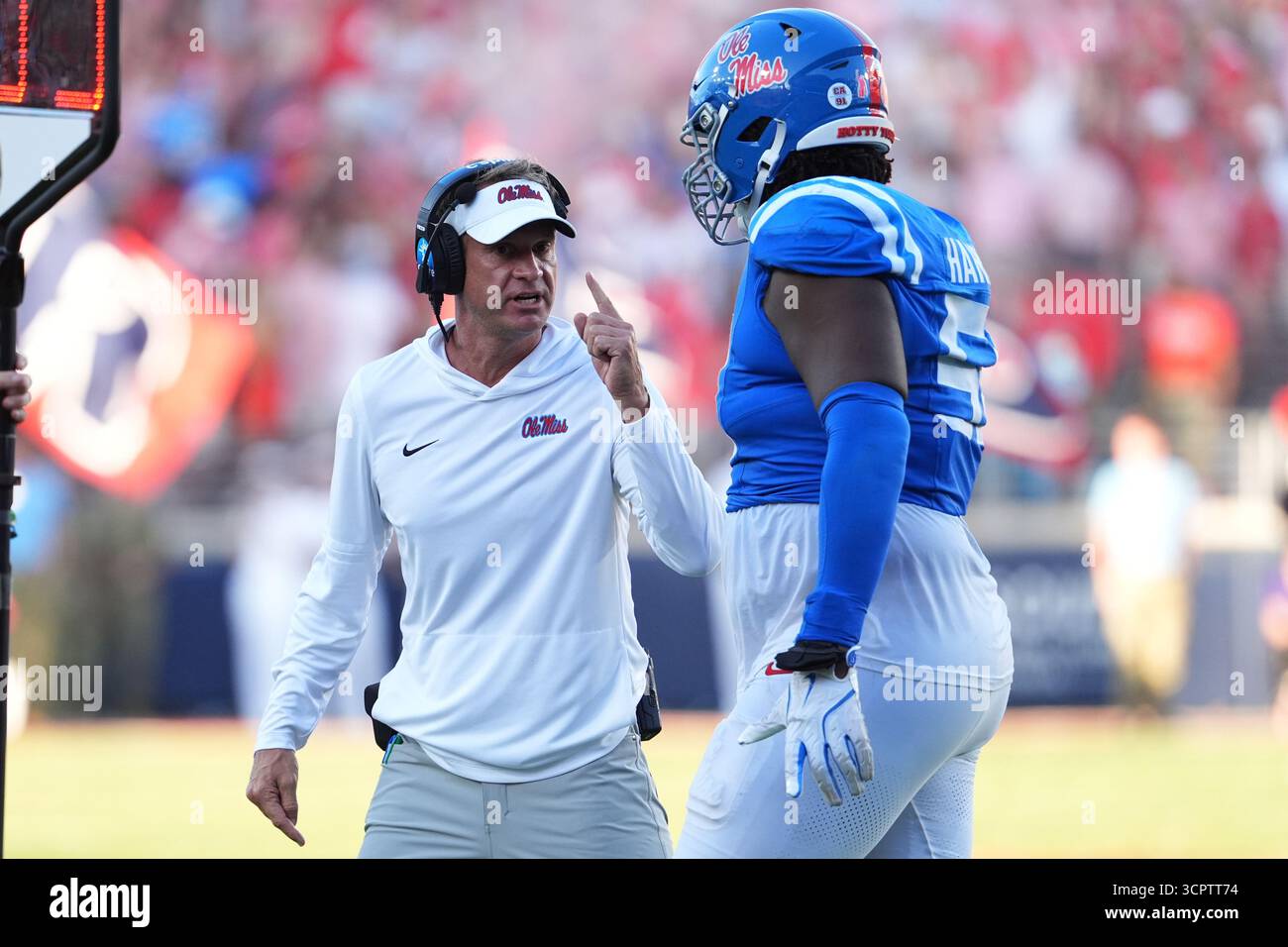 Mississippi head coach Lane Kiffin confers with defensive tackle ...