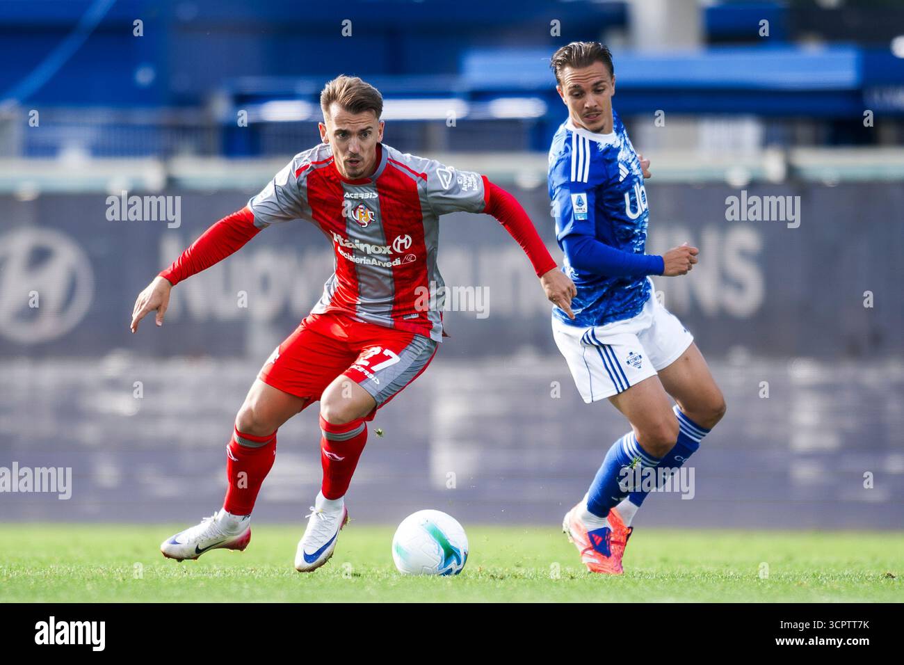 Jari Vandeputte of US Cremonese ompetes for the ball with Maxence ...