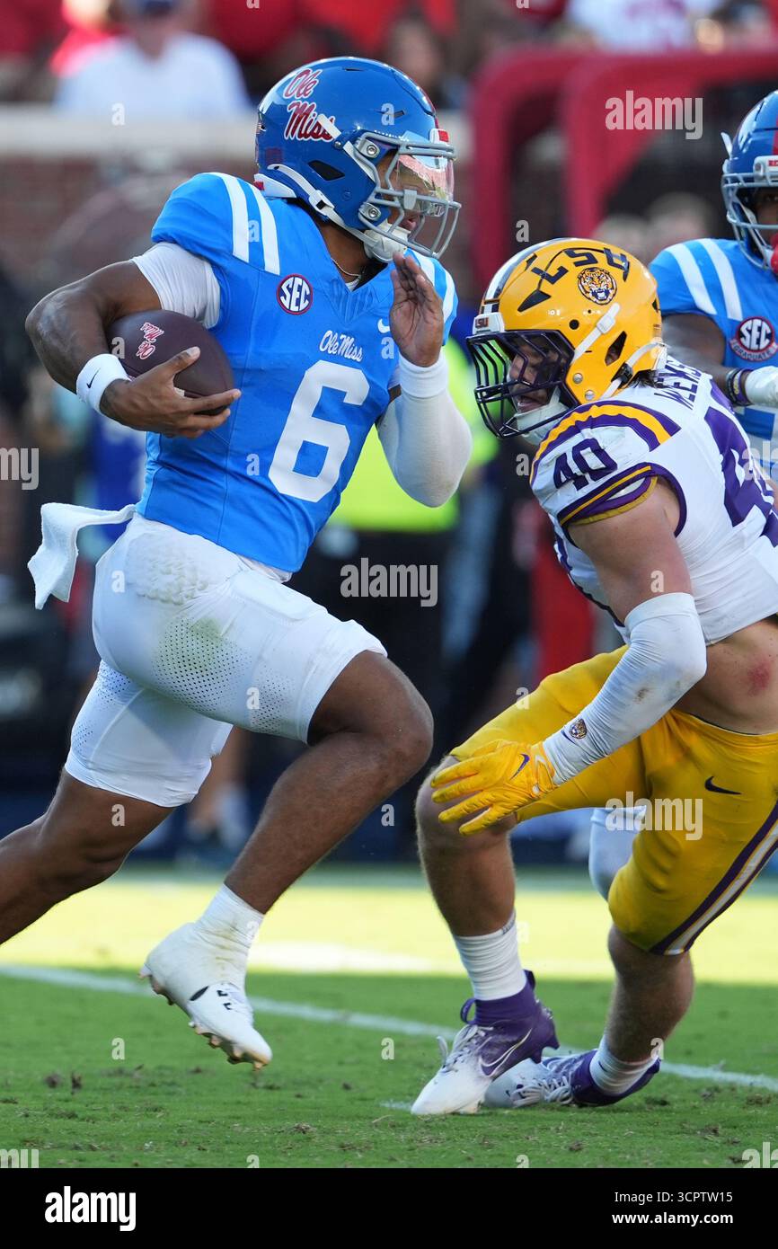 Mississippi quarterback Trinidad Chambliss (6) runs past LSU linebacker ...