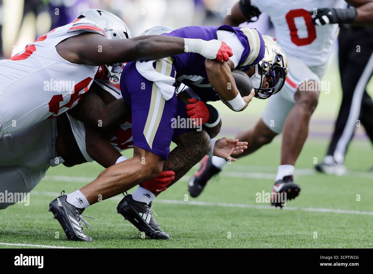 Ohio State defensive tackle Tywone Malone Jr. (95) tackles Washington ...