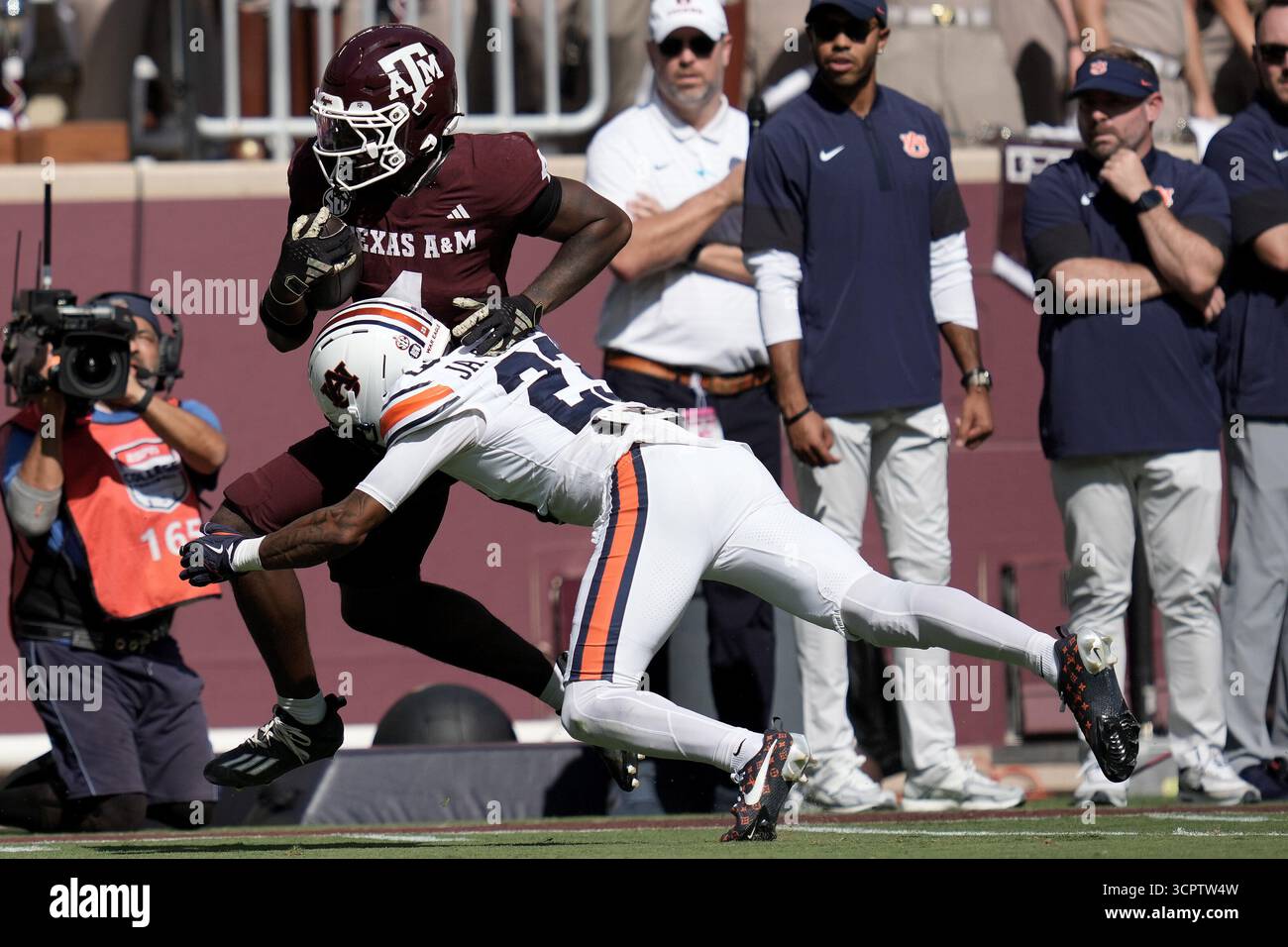 Texas A&M tight end Amari Niblack (84) is knocked out of bounds by Auburn cornerback Jay ...