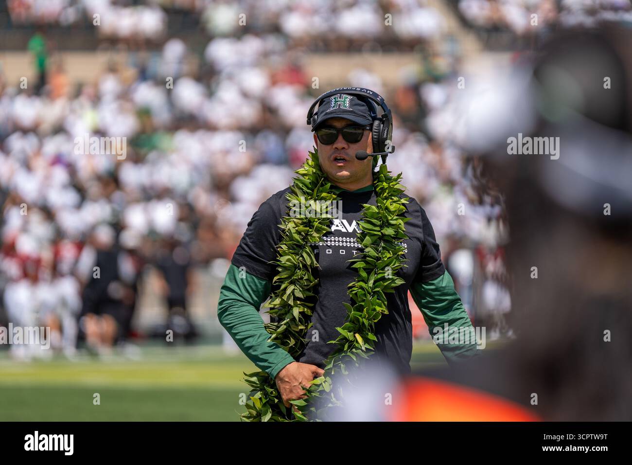 University of Hawaii football coach Timmy Chang on the sidelines ...