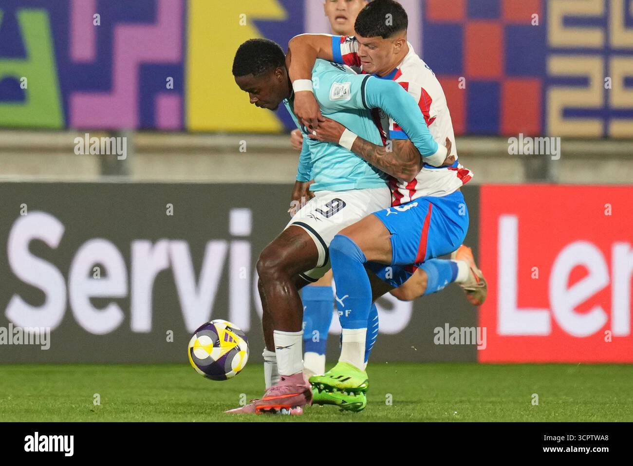 Panama's Gustavo Herrera, left, and Paraguay's Axel Balbuena battle for the ball during a FIFA U ...