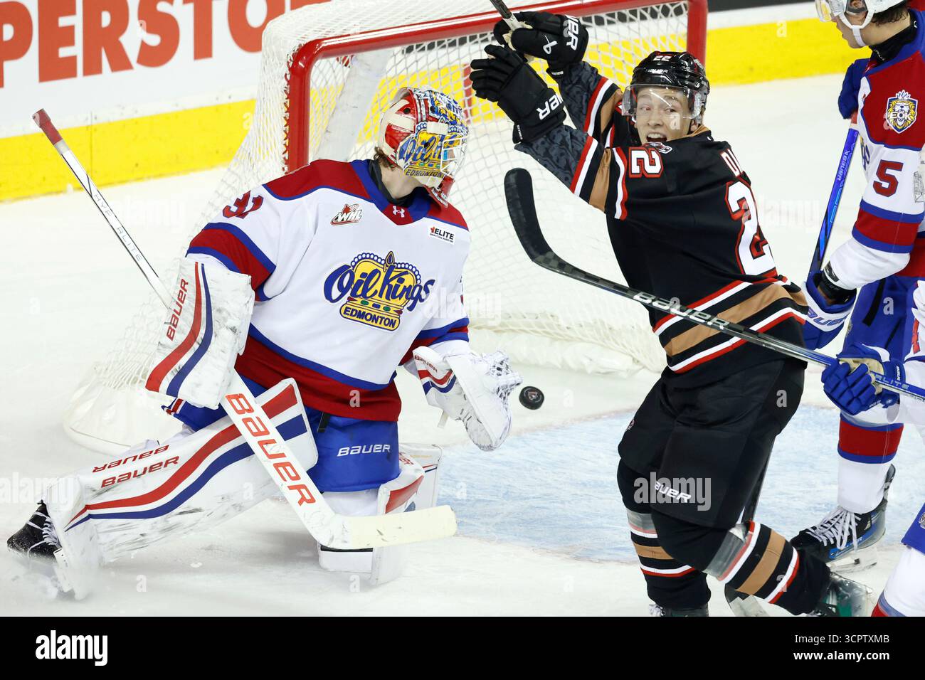 Calgary Hitmen C Kale Dach, rt, celebrates a goal against Edmonton Oil ...