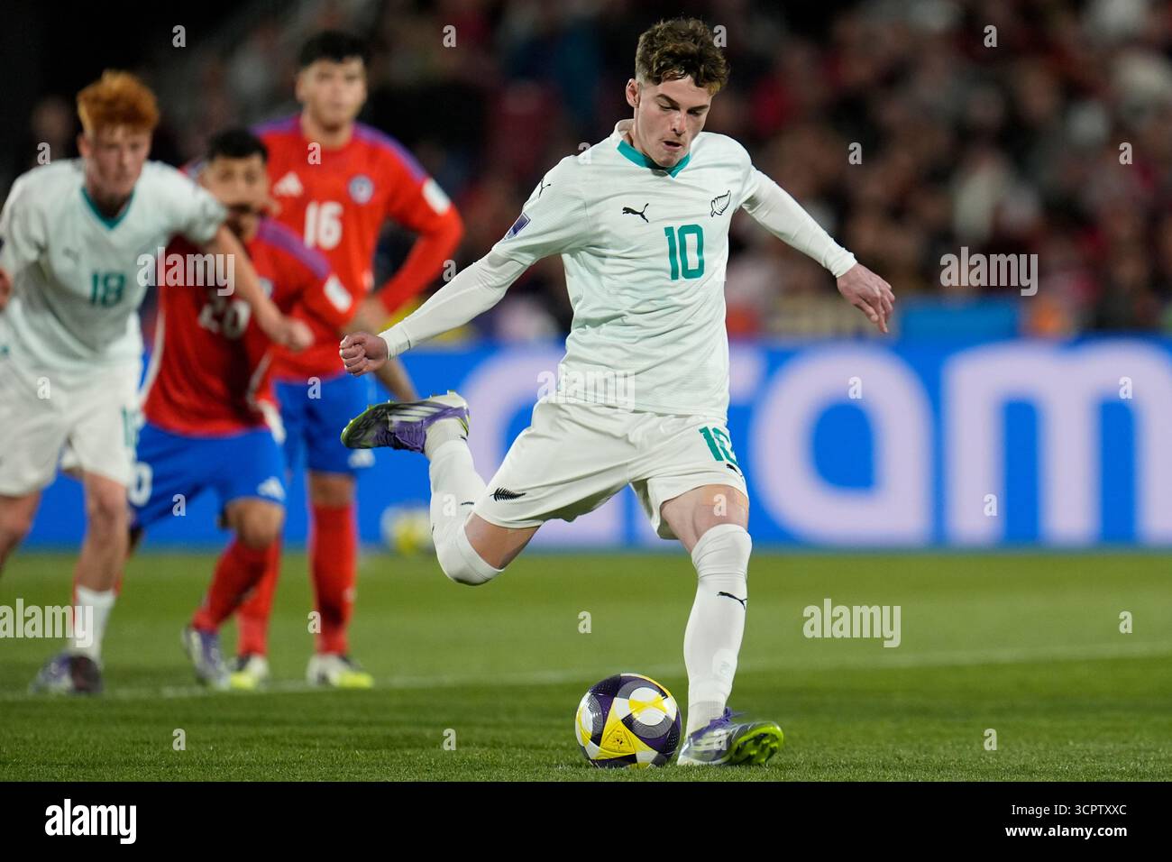New Zealand's Nathan Walker scores from the penalty spot against Chile ...