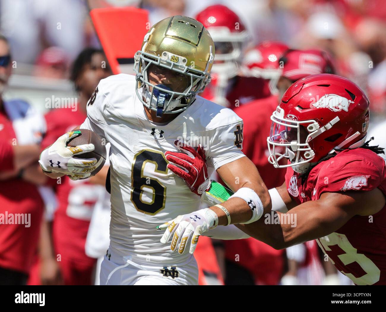 September 27, 2025: Notre Dame receiver Jordan Faison (6) works to get away from Arkansas ...
