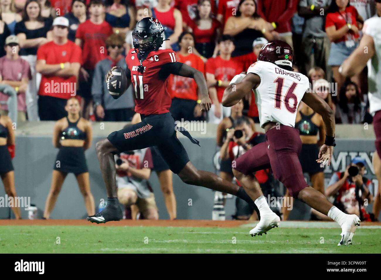 North Carolina State quarterback CJ Bailey (11) runs the ball away from ...