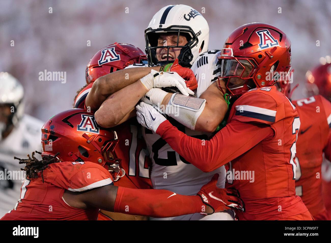 Iowa State running back Carson Hansen (26) pulls for more yards as he ...