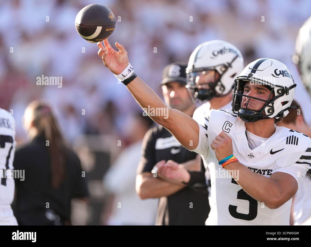 Iowa State quarterback Rocco Becht (3) warms up before an NCAA college ...