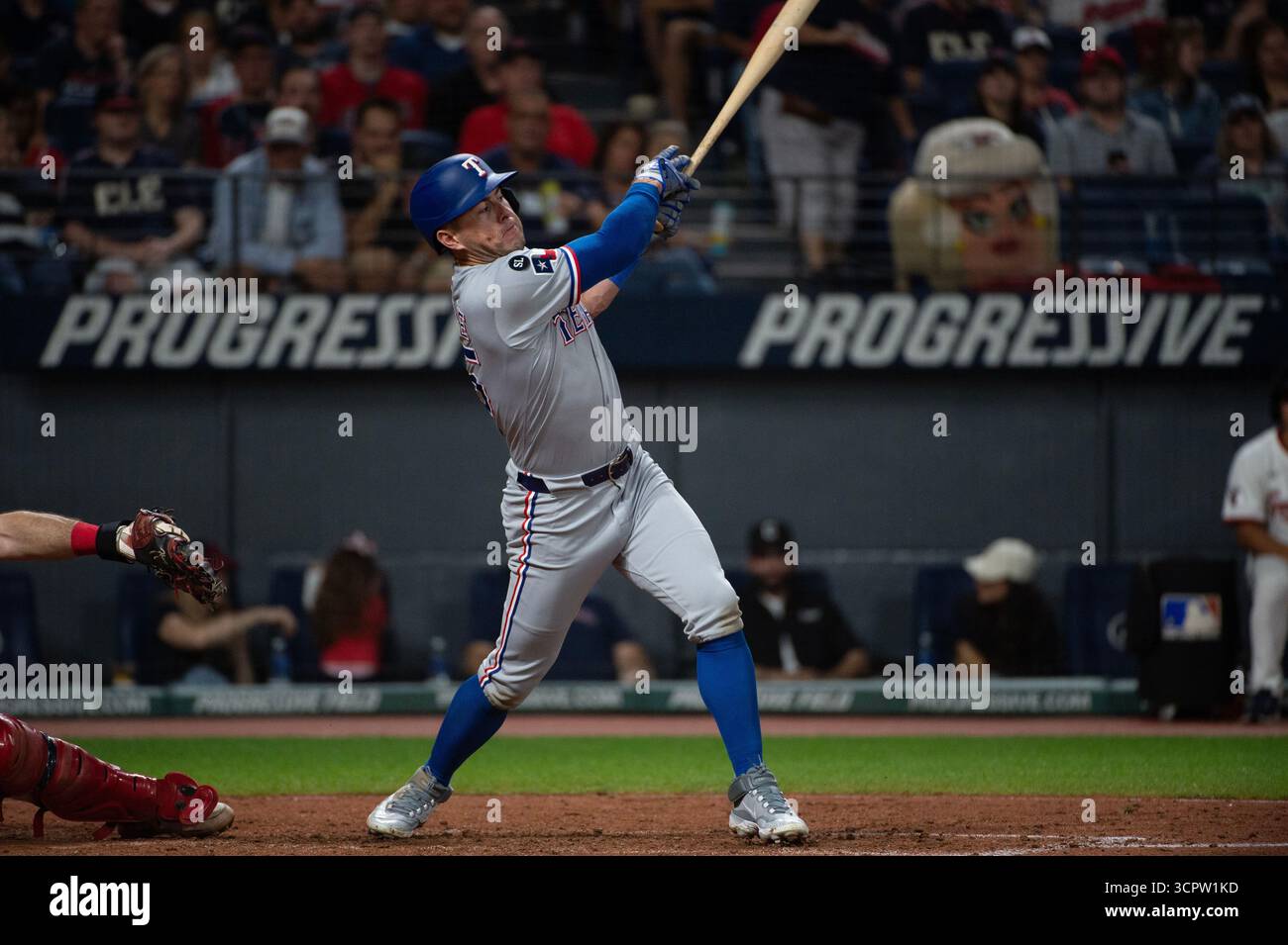 Texas Rangers' Dylan Moore hits a single off Cleveland Guardians relief ...