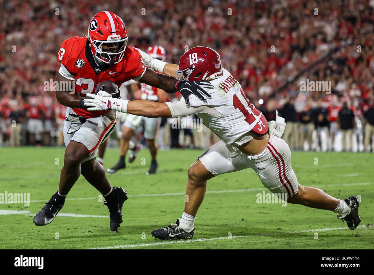 Georgia running back Chauncey Bowens, left, runs with the ball against ...