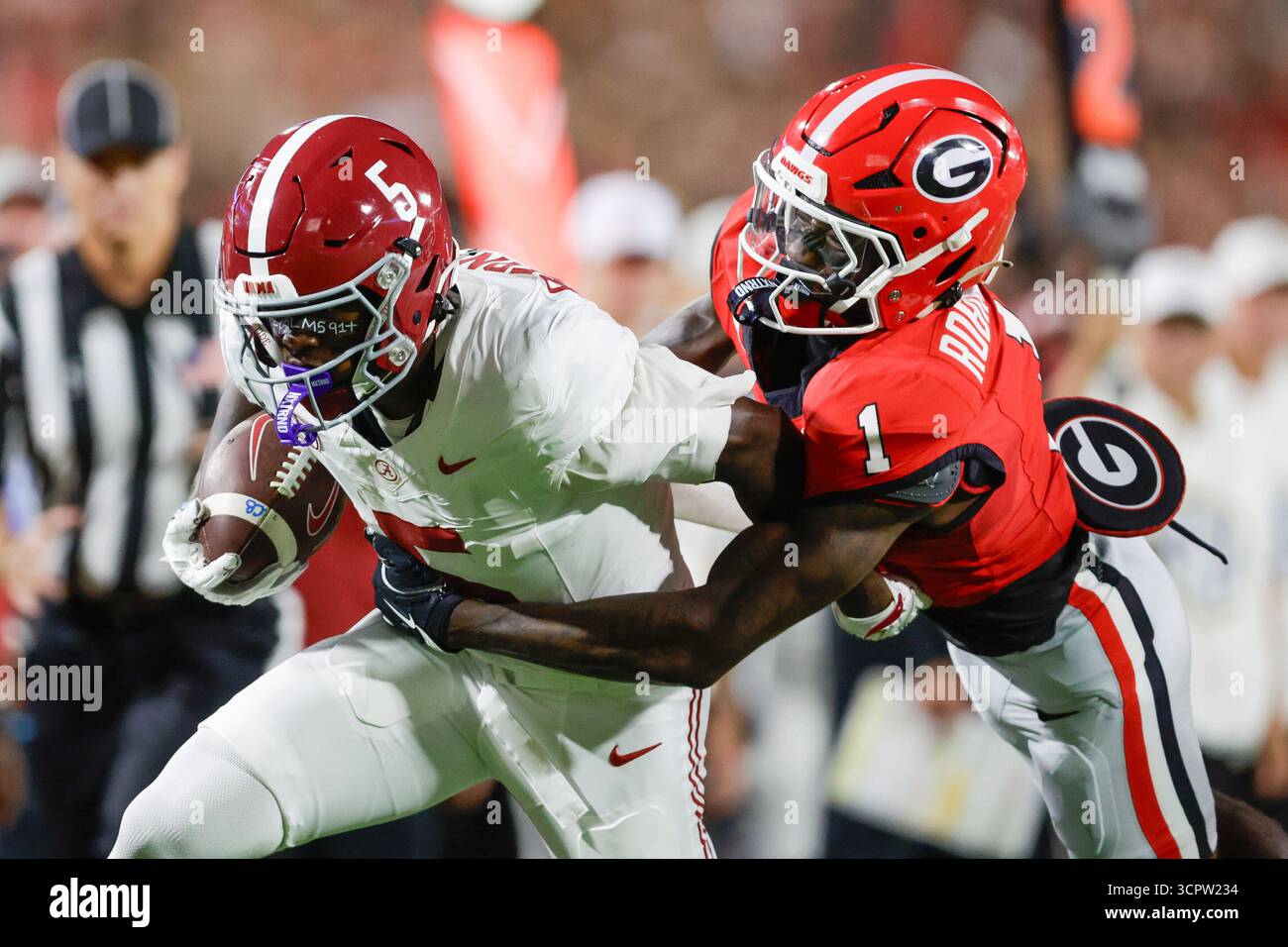 Alabama wide receiver Germie Bernard (5) is tackled by Georgia ...
