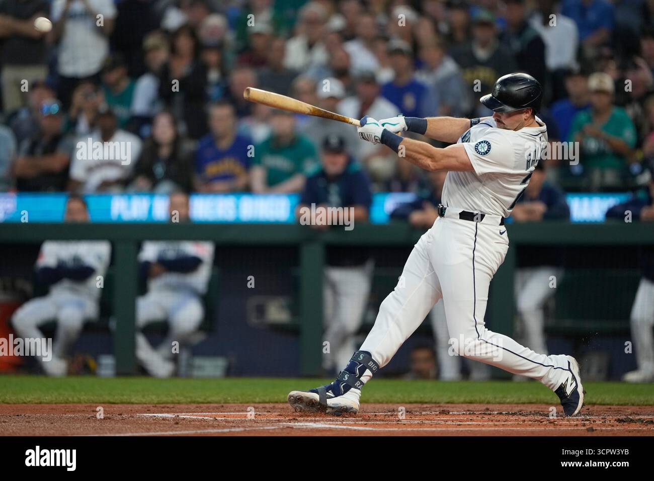 Seattle Mariners designated hitter Cal Raleigh fouls off a ball during ...