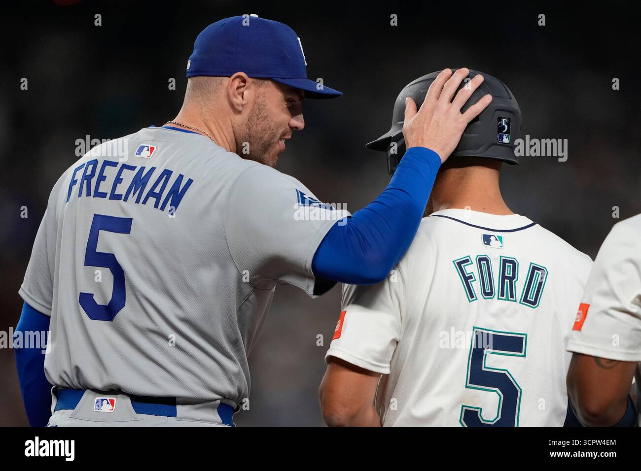 Los Angeles Dodgers first baseman Freddie Freeman, left, congratulates ...