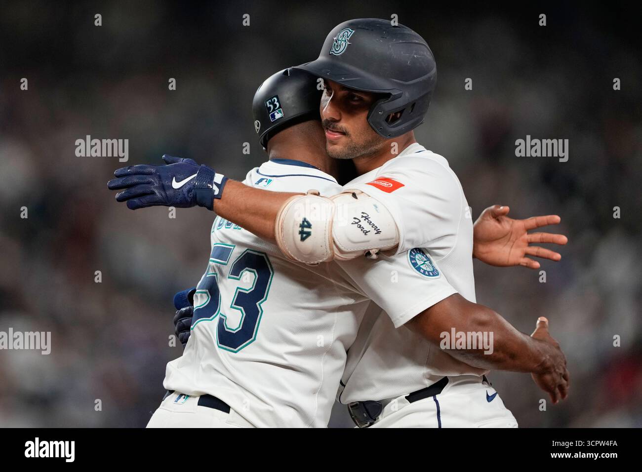 Seattle Mariners first base coach Eric Young Jr. (53) celebrates with ...