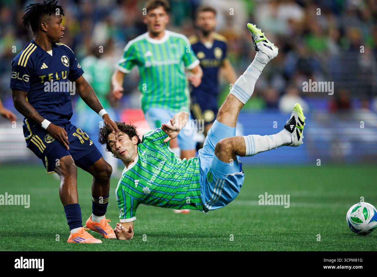 Seattle Sounders FC forward Paul Rothrock, center, attempts a bicycle ...