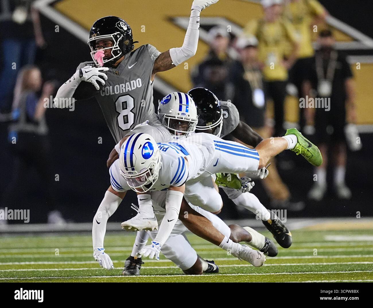 Colorado wide receiver Joseph Williams (8) is pulled down after ...