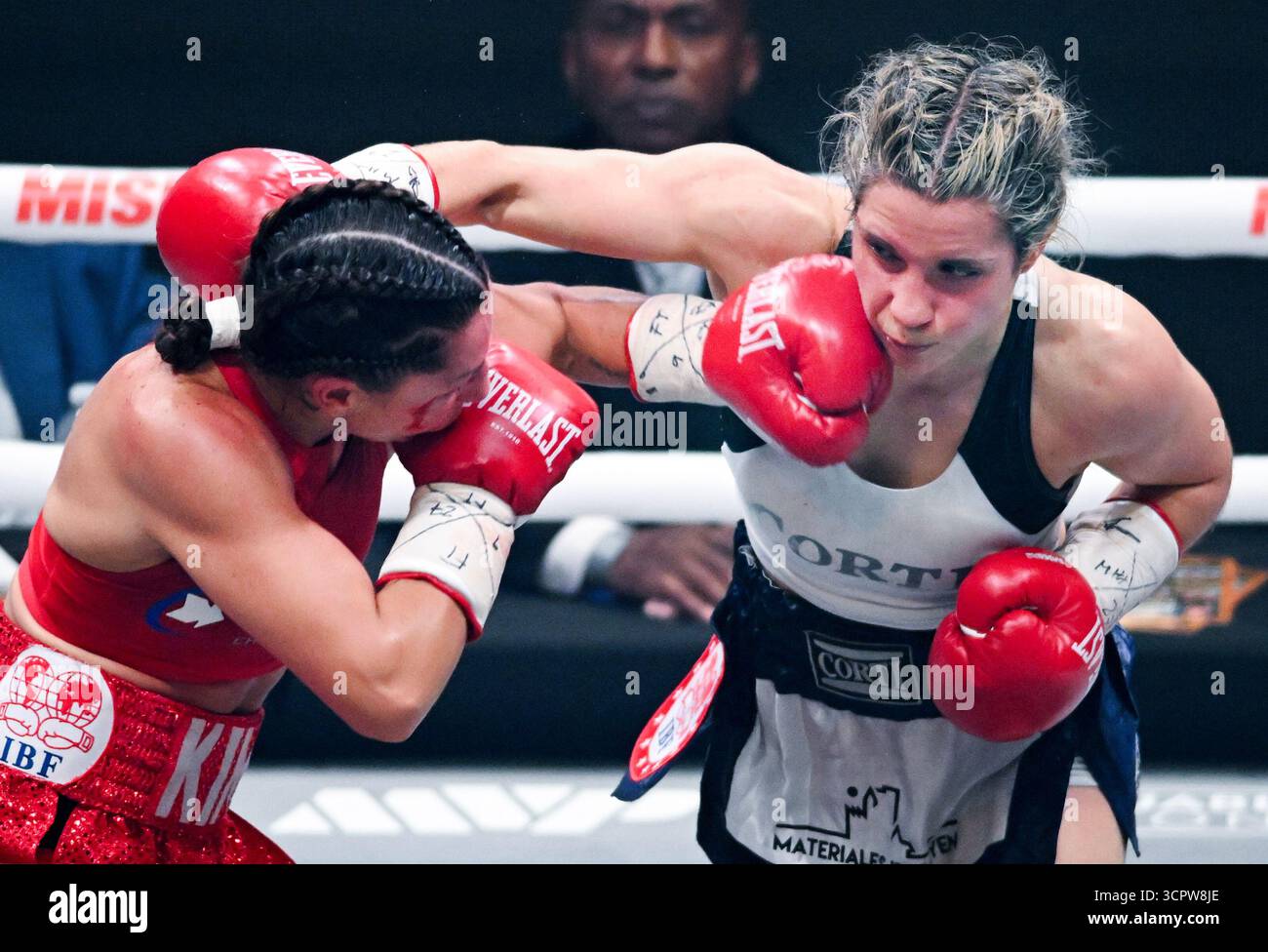 Kim Clavel, left, trades blows with Sol Cudos during their IBF World ...
