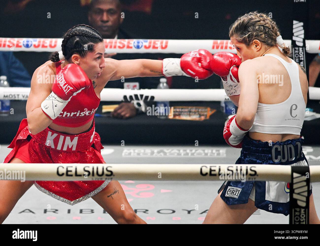 Kim Clavel, left, trades blows with Sol Cudos during their IBF World ...